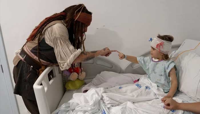Johnny Depp brings Jack Sparrow to life again for children’s hospital visit